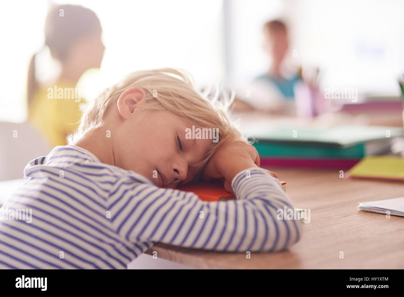 Sleepy day of elementary school pupil Stock Photo - Alamy