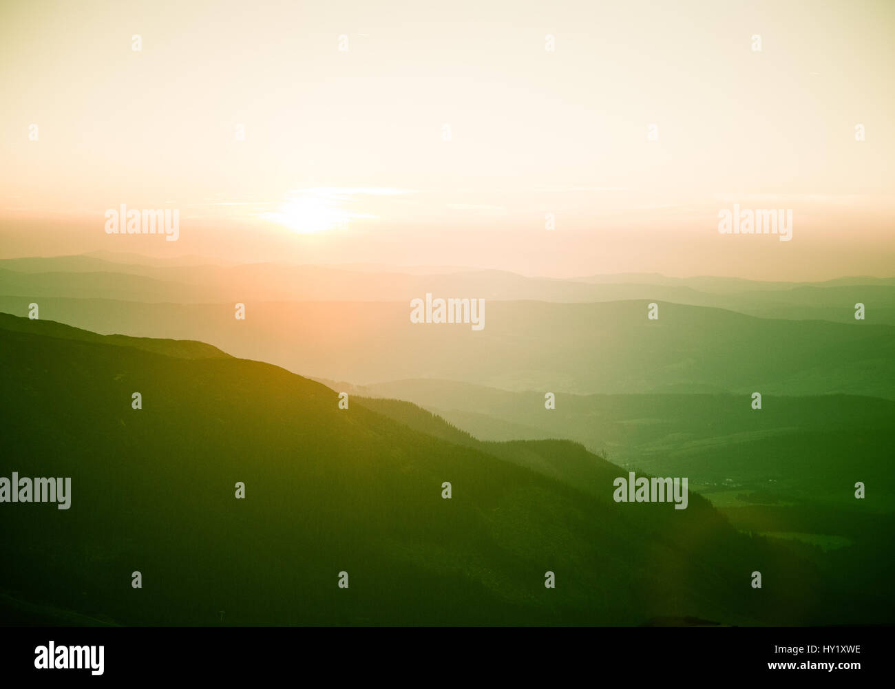 A beautiful, colorful, abstract mountain landscape with sun with a hot ...