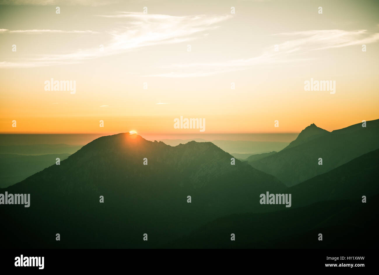 A beautiful, colorful, abstract mountain landscape with sun with a hot ...