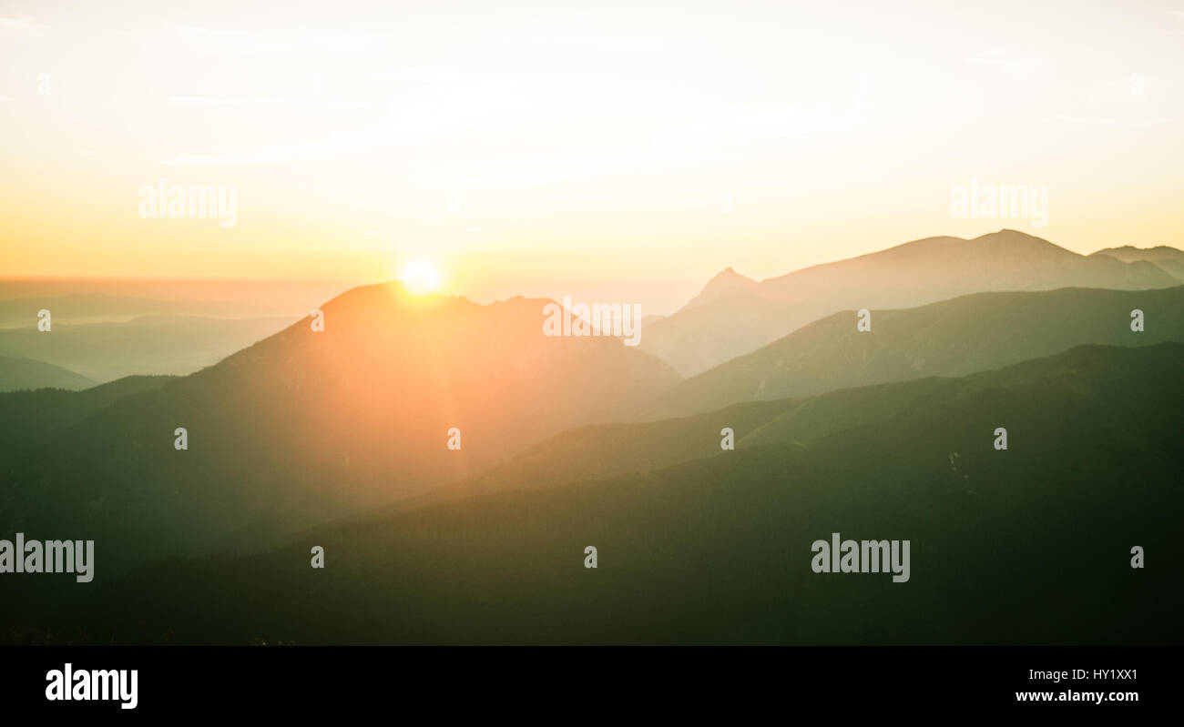 A beautiful, colorful, abstract mountain landscape with sun with a hot ...