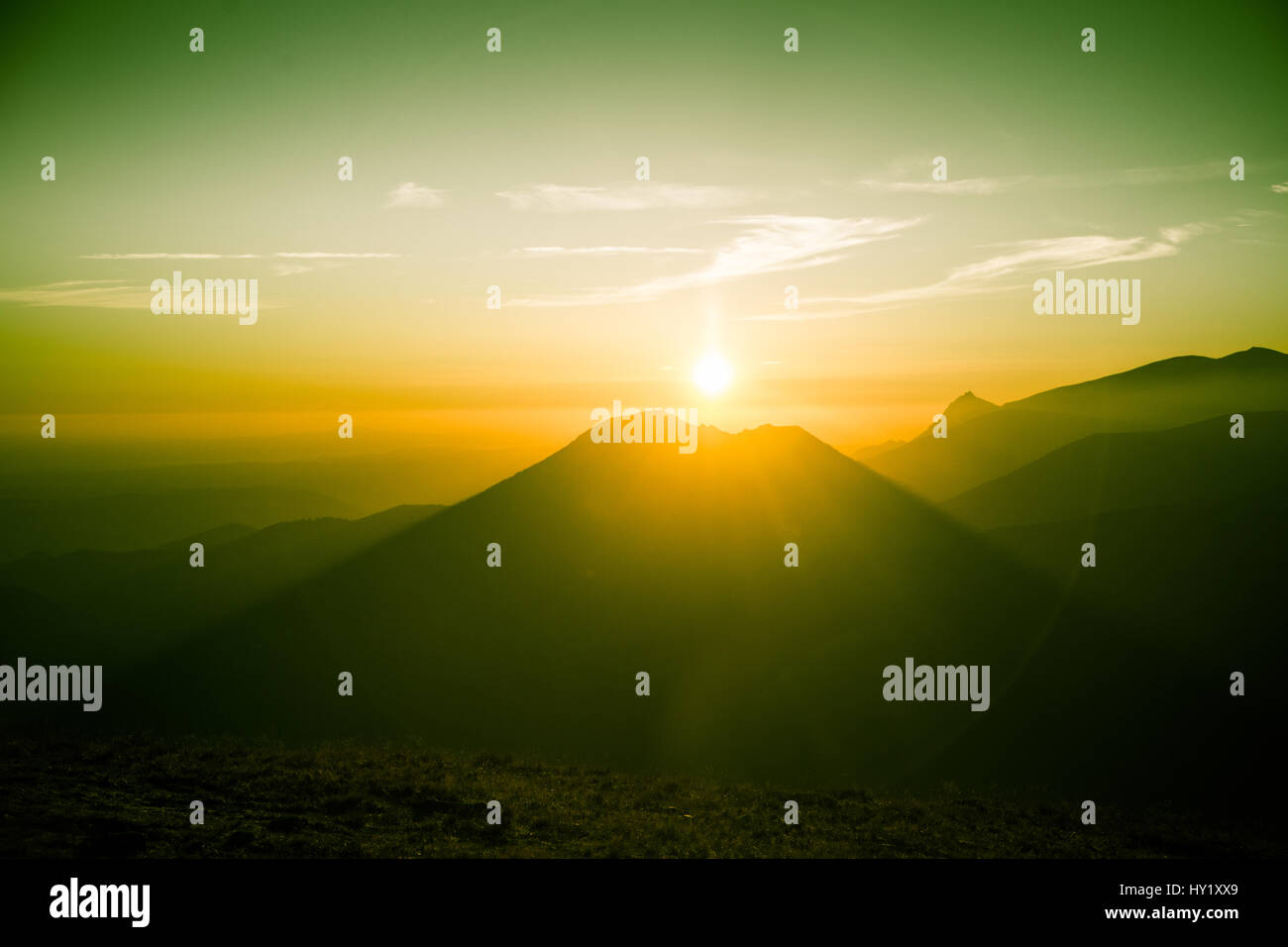 A beautiful, colorful, abstract mountain landscape with sun with a hot ...