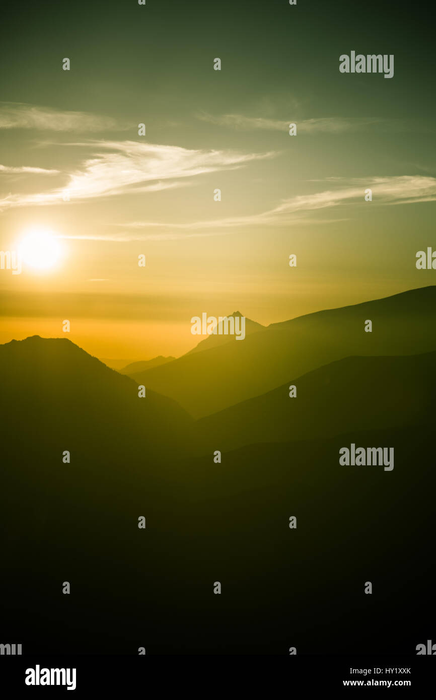 A beautiful, colorful, abstract mountain landscape with sun with a hot ...