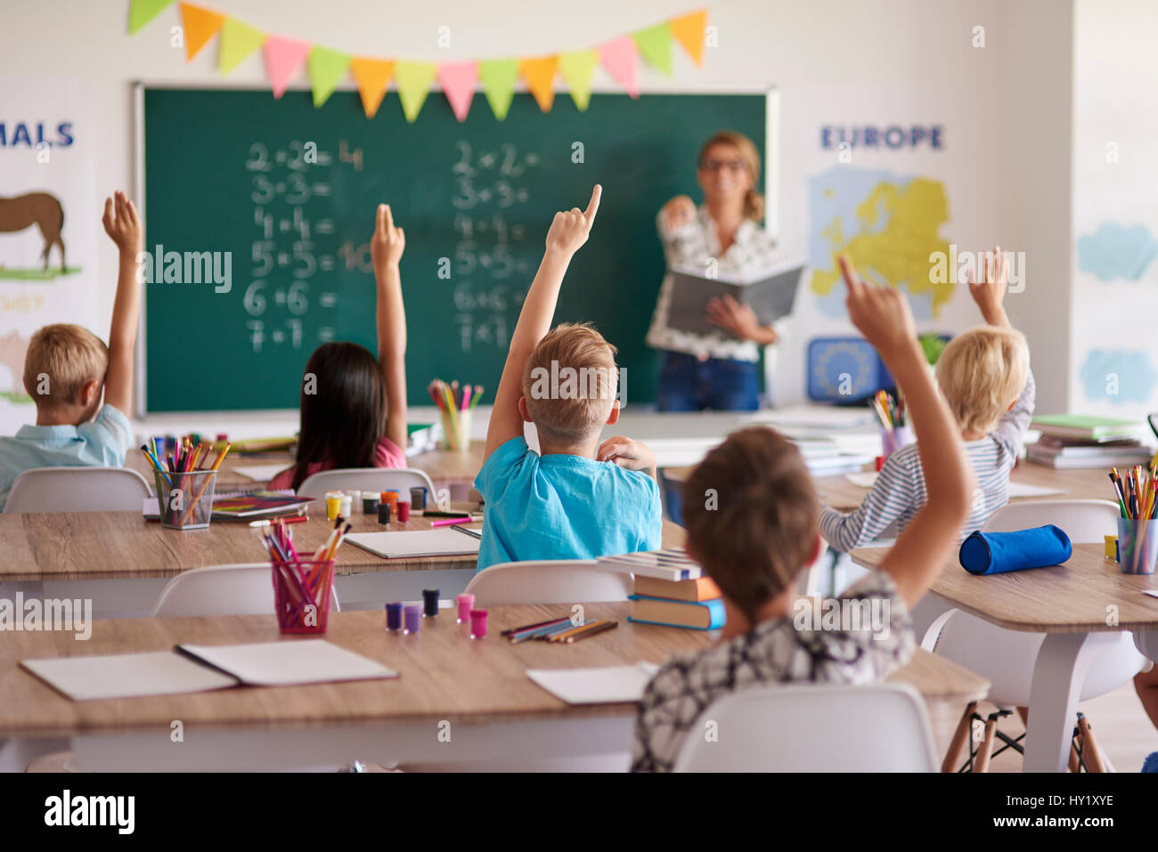 Teacher students arms raised hi-res stock photography and images - Alamy
