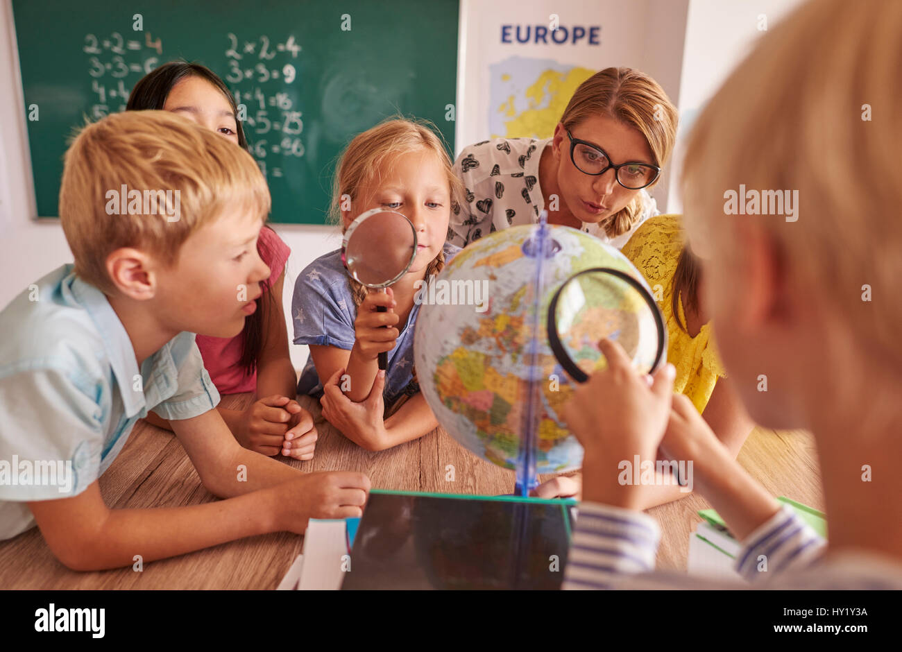 Children with globe hi-res stock photography and images - Alamy