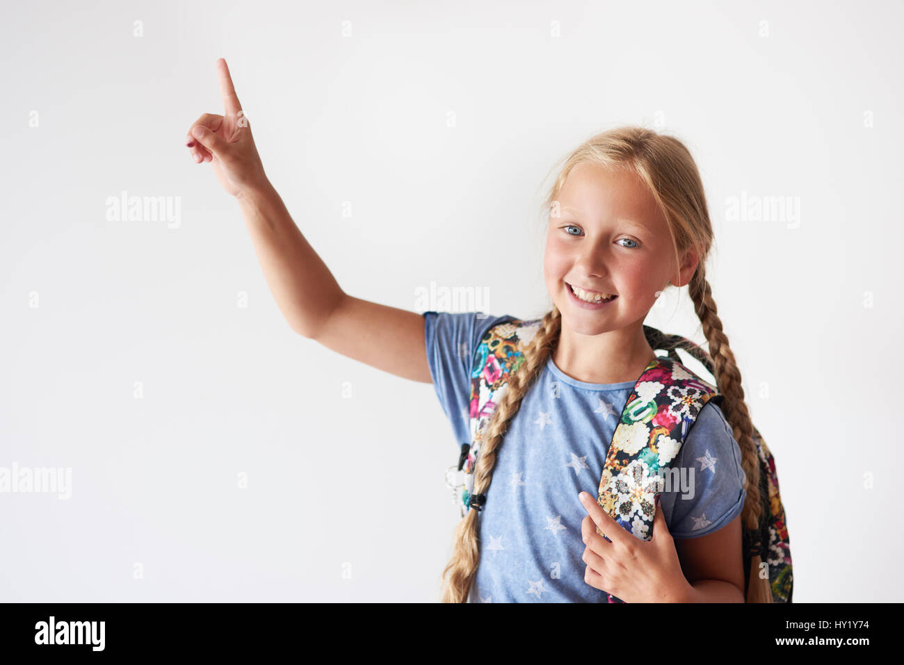 School girl pointing by right hand Stock Photo - Alamy
