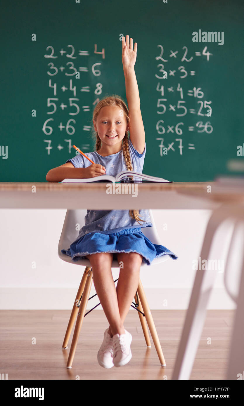 Blond girl coming forward as first Stock Photo - Alamy
