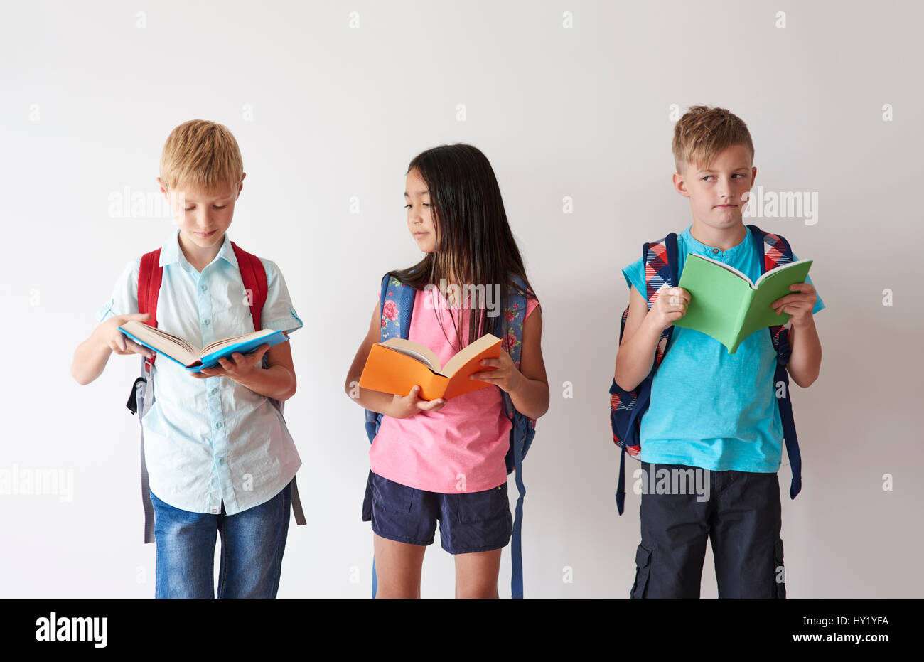 Kids studying hard for coming up lesson Stock Photo - Alamy