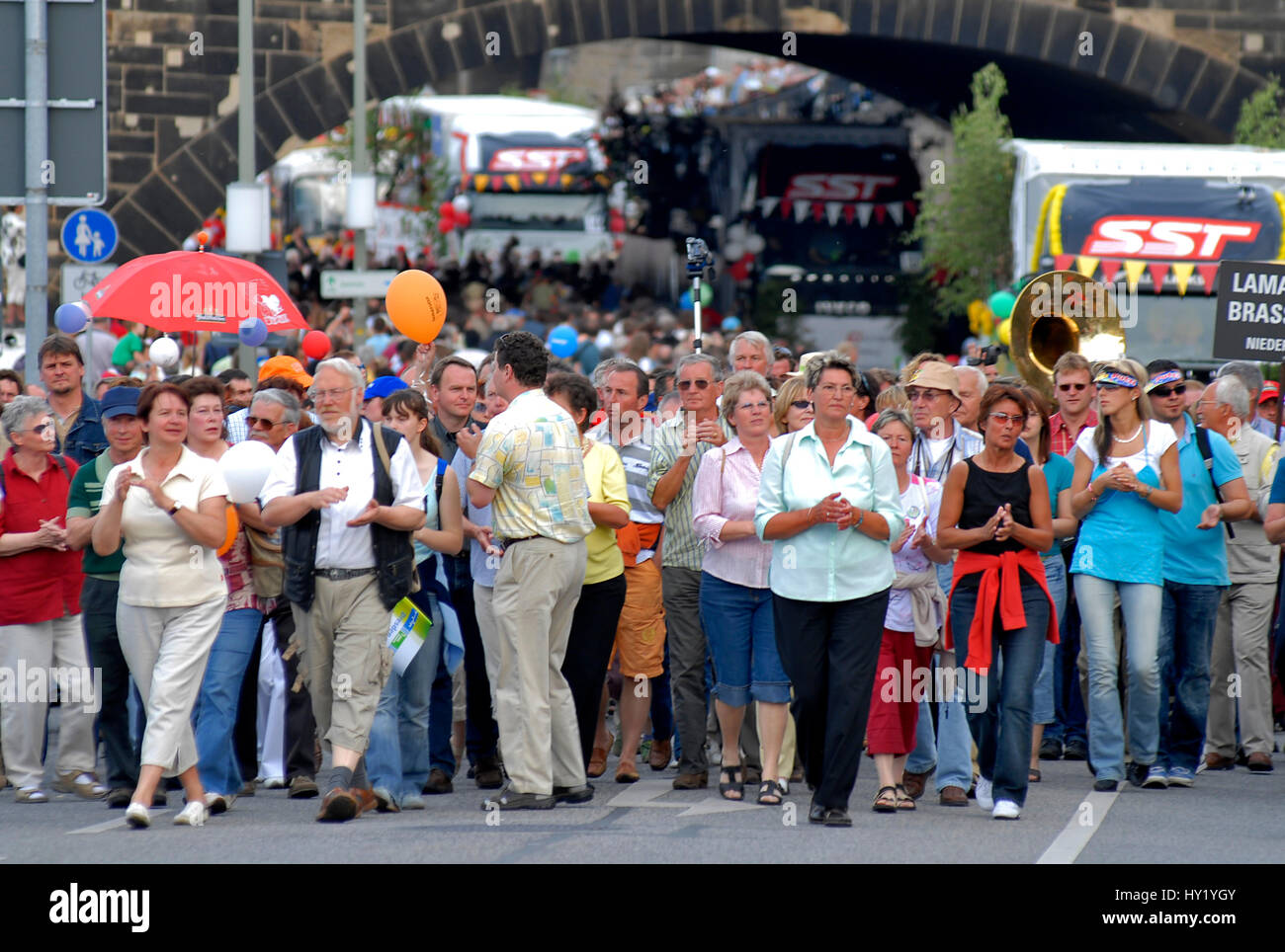 Tourists and Locals dancing at the parade during the Annual Dixieland ...
