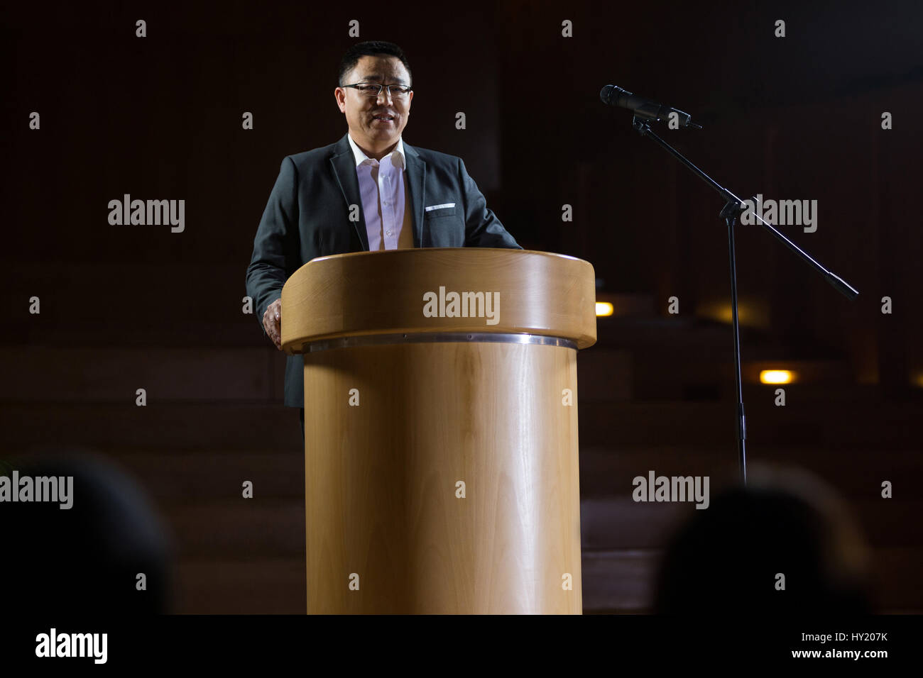 Business executive giving a speech at conference center Stock Photo - Alamy