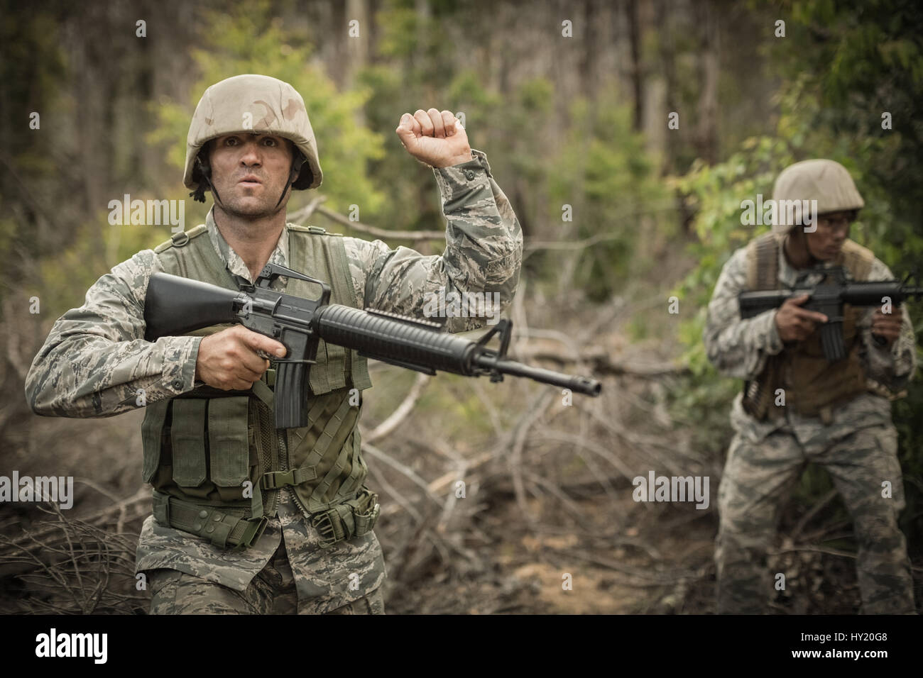 Military soldiers during training exercise with weapon at boot camp ...