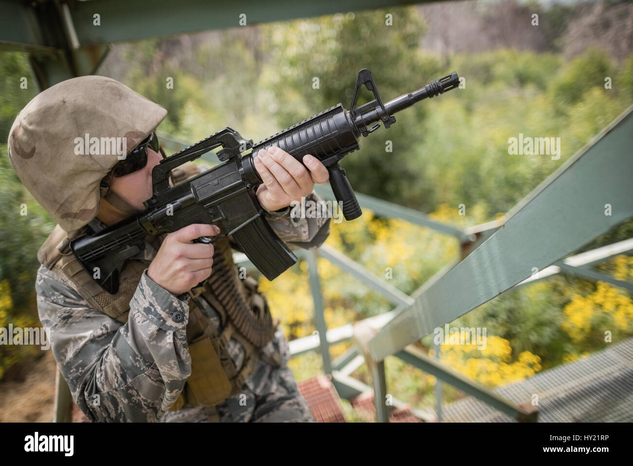 Military soldier guarding with a rifle in boot camp Stock Photo - Alamy