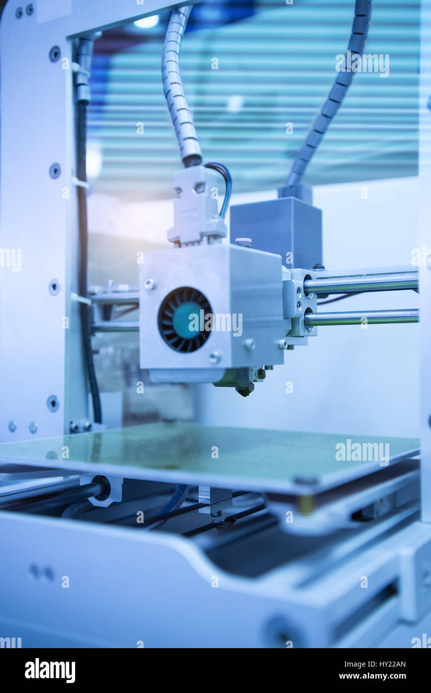 3D printer on a blue background Stock Photo - Alamy