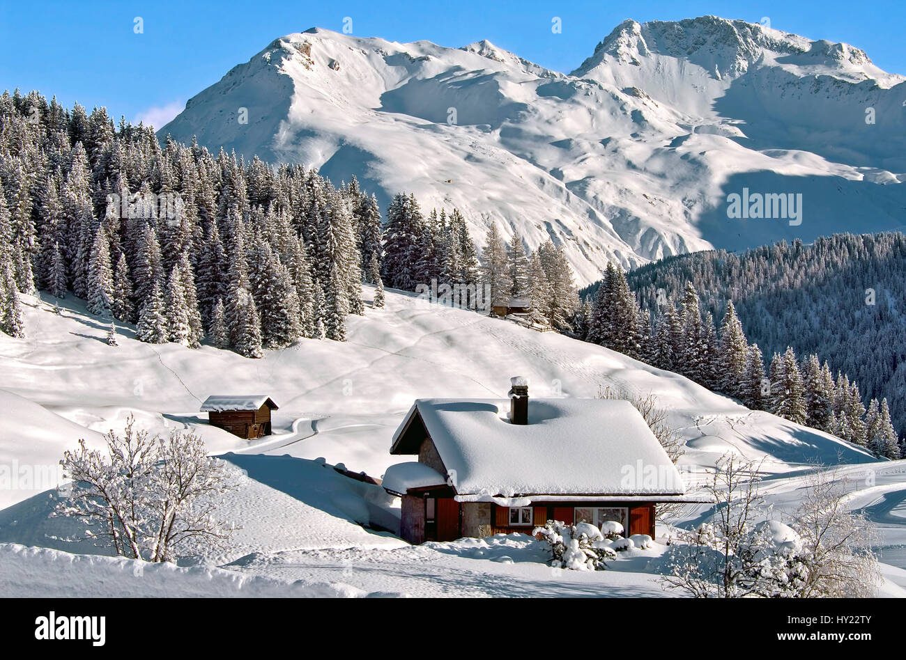 Small wooden mountain house within a beautiful Winter landscape in ...