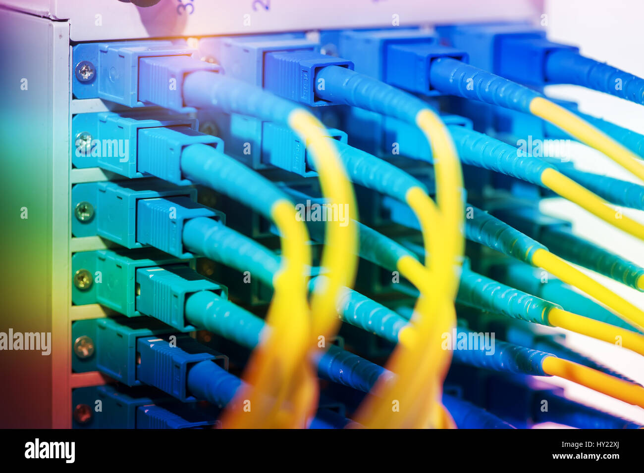 fiber optic telecommunication cables on blur background Stock Photo - Alamy
