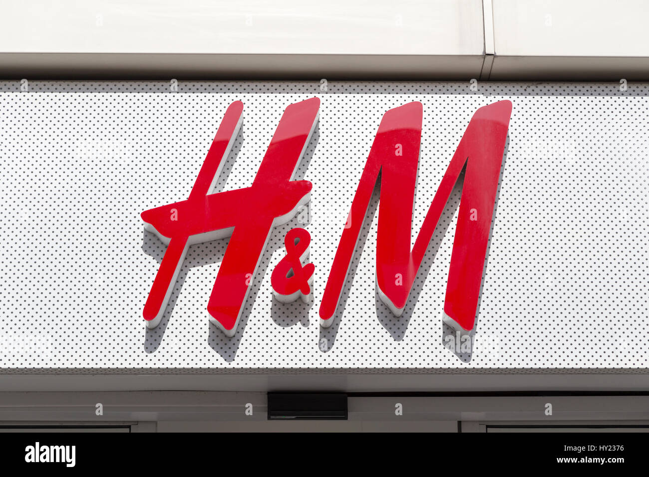 H&M sign over shop entrance Stock Photo - Alamy