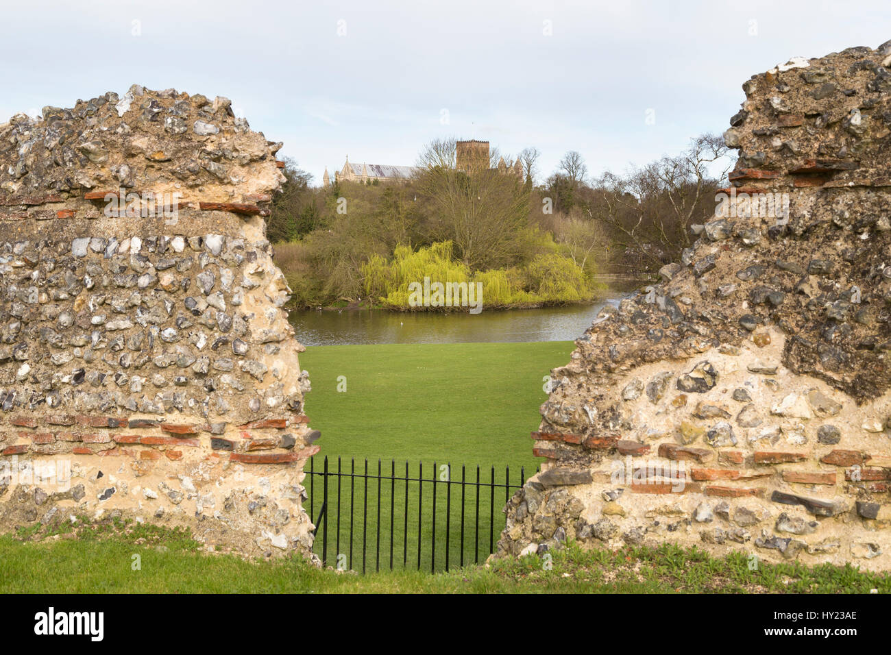 View of St Albans Cathedral through the remains of the Roman Wall Stock ...
