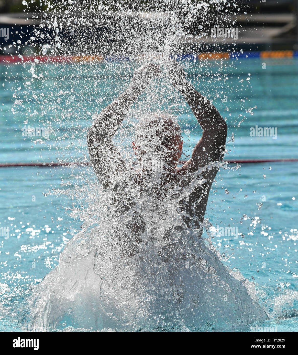 The first swimmer of the year takes a dip in the open-air swimming pool ...