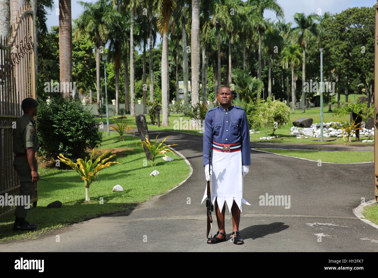 Suva, Fiji. 1st Apr, 2017. A soldier wearing a sulu skirt stands guard ...