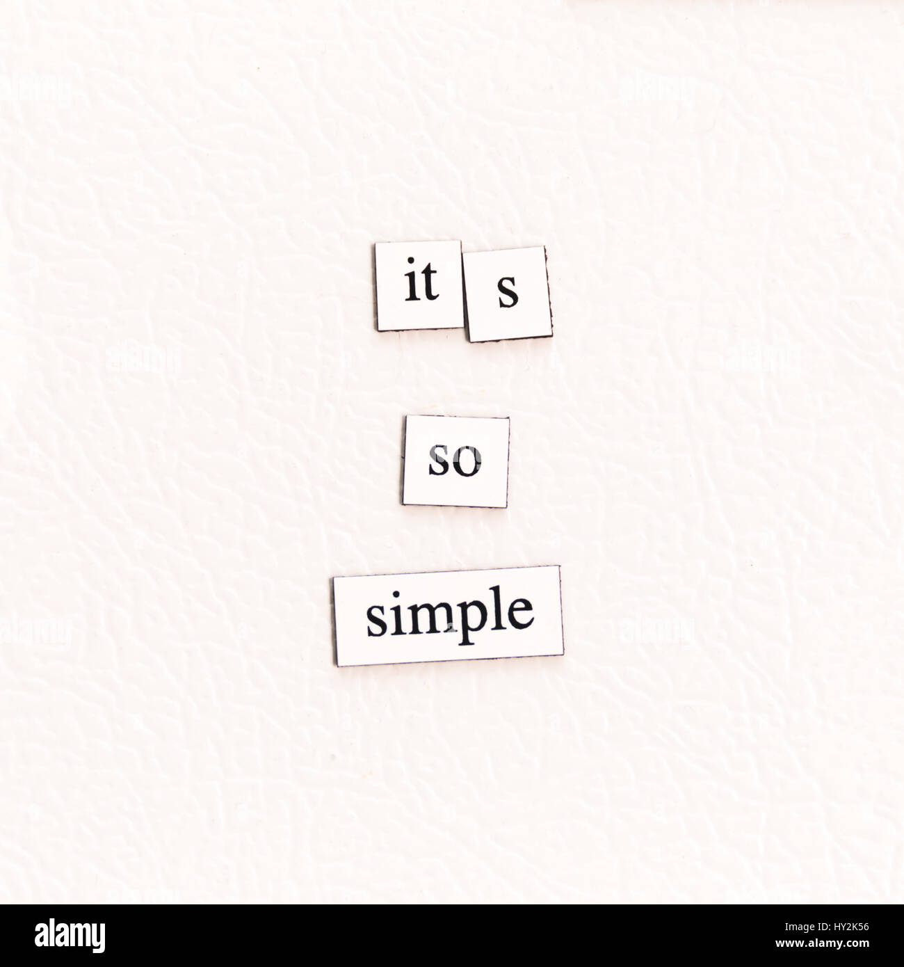 Magnets on a refrigerator stating "it's so simple Stock Photo - Alamy