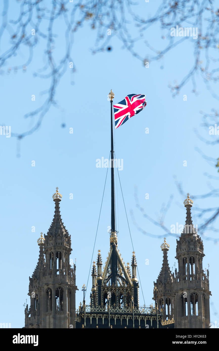 Union Jack flag flutters over the Sovereign's entrance, Houses of ...