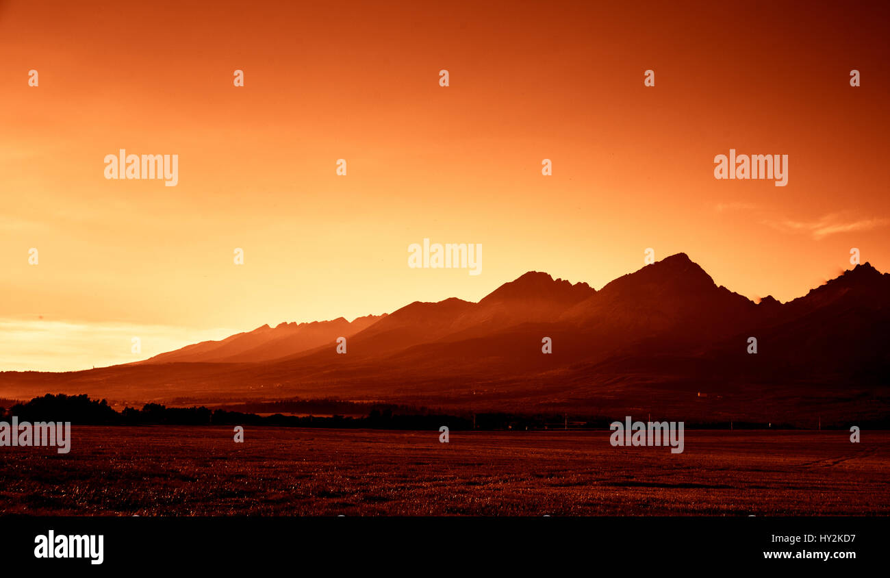 A beautiful, colorful, abstract mountain landscape in a red tonality ...