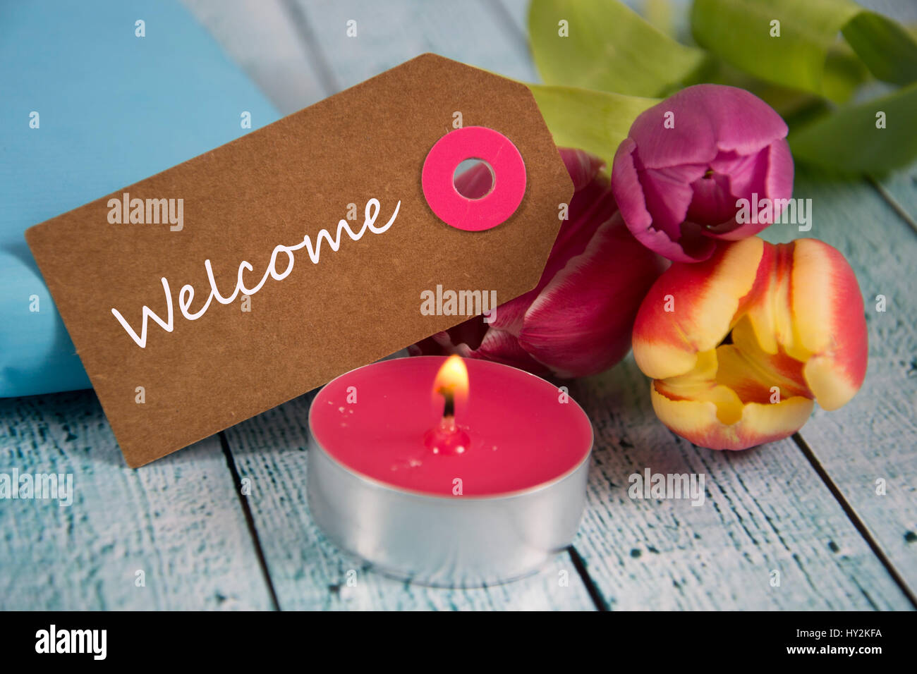 Welcome sign with tulips Stock Photo - Alamy