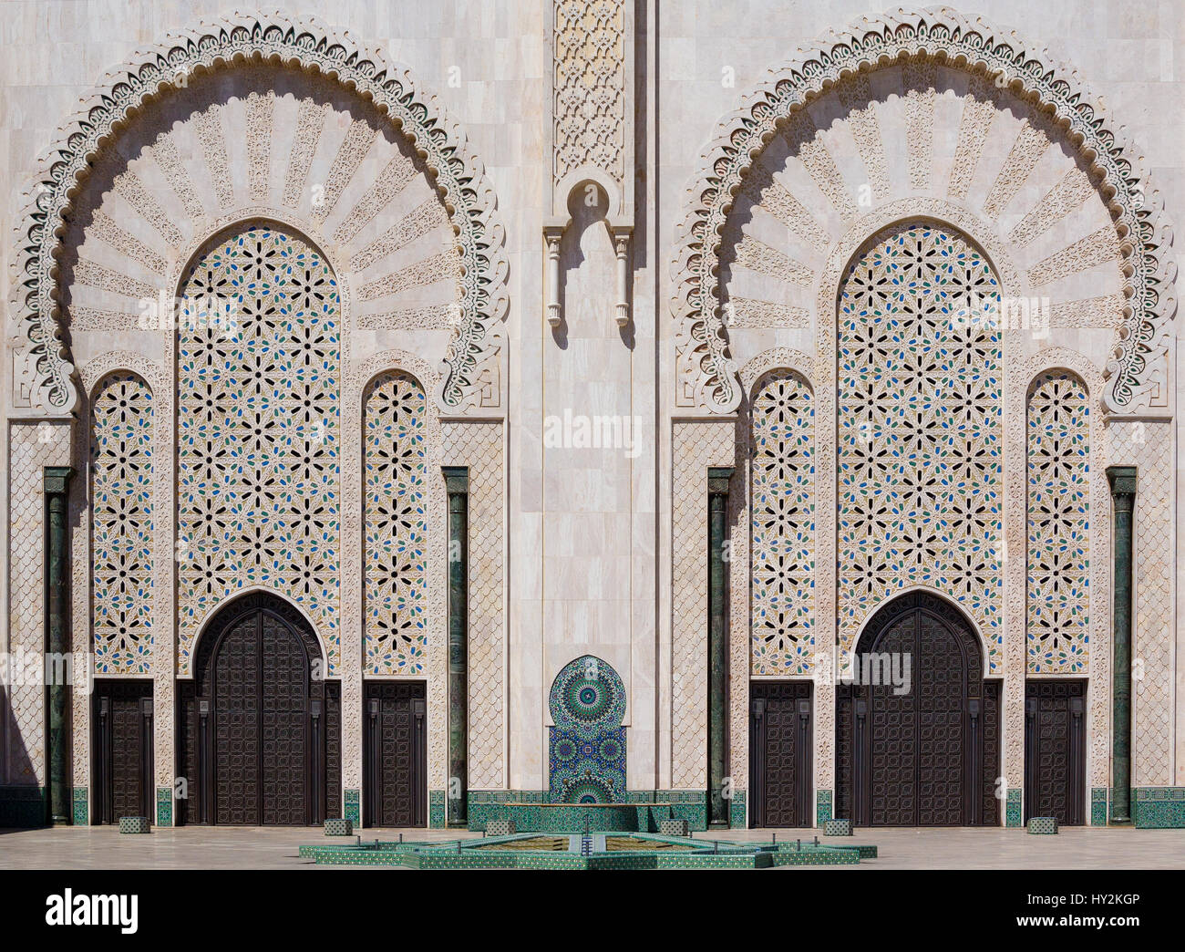 Two symmetrical ornamental entrance to temple in Morocco Stock Photo ...