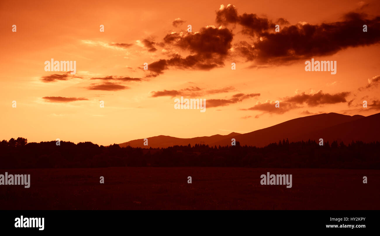 A beautiful, colorful, abstract mountain landscape in a red tonality ...