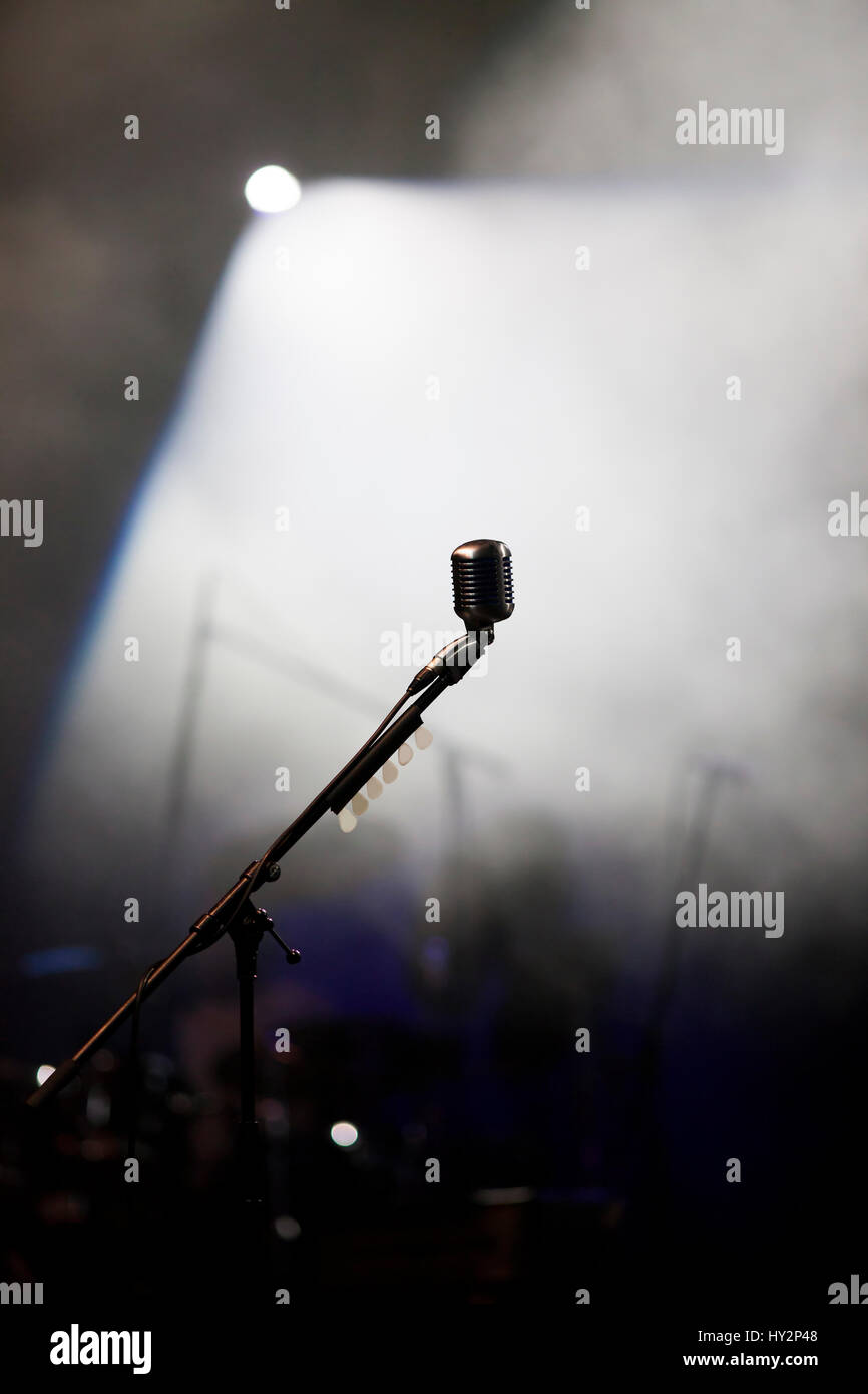 microphone in stage lights during concert Stock Photo - Alamy
