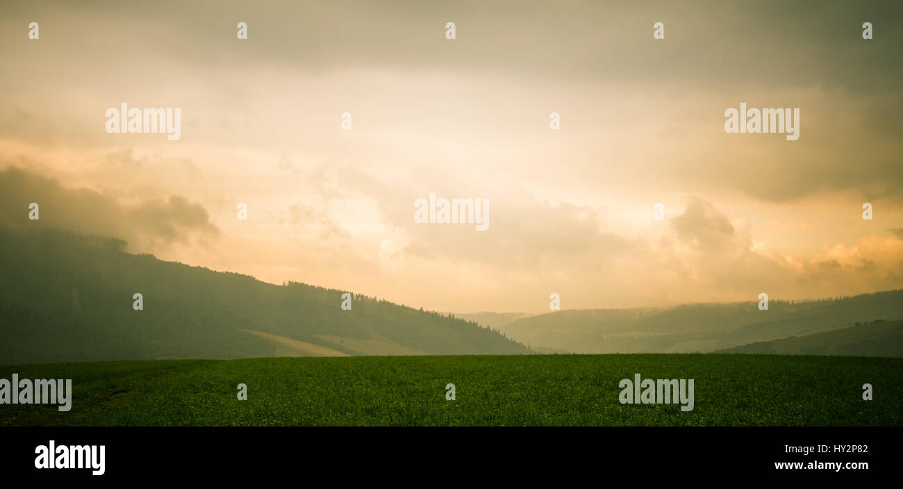 A beautiful, colorful, abstract mountain landscape with a hot summer ...