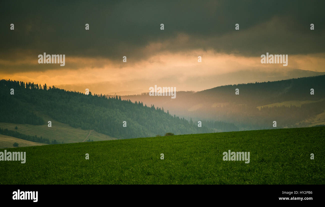 A beautiful, colorful, abstract mountain landscape with a hot summer ...