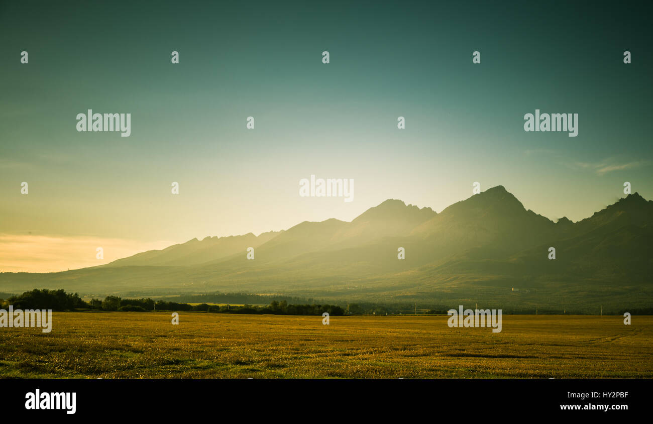 A beautiful, colorful, abstract mountain landscape with a hot summer ...