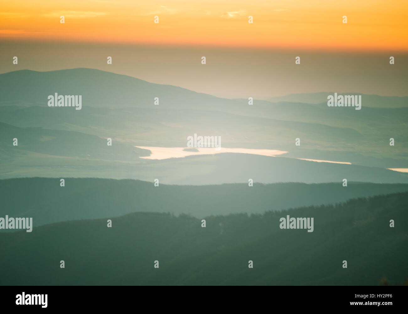 A beautiful, colorful, abstract mountain landscape with a hot summer ...