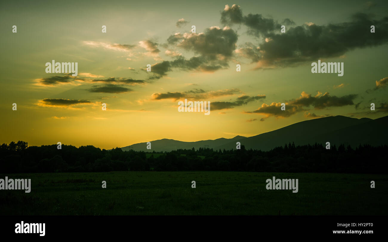 A beautiful, colorful, abstract mountain landscape with a hot summer ...