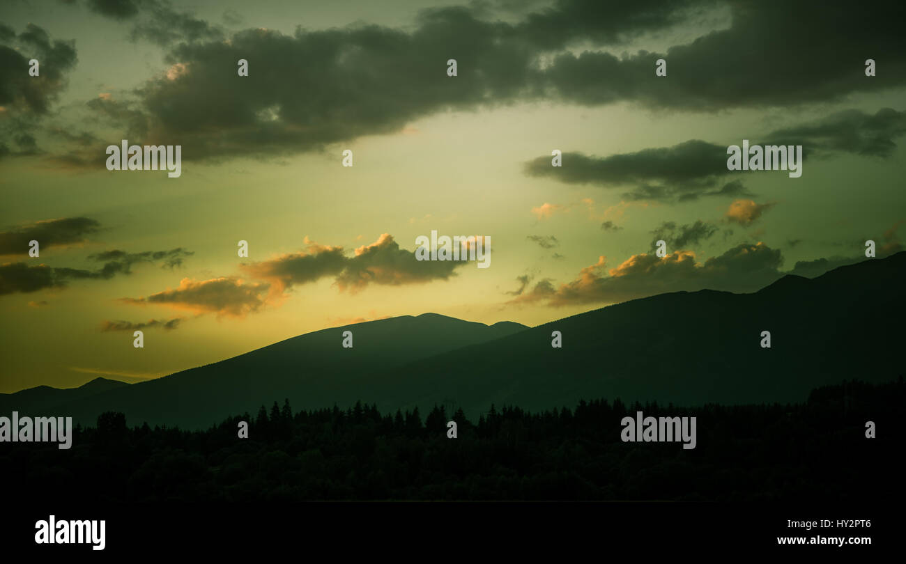 A beautiful, colorful, abstract mountain landscape with a hot summer ...