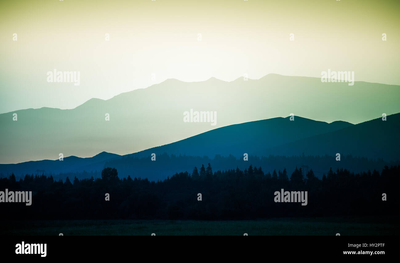 A beautiful, colorful, abstract mountain landscape with a hot summer ...