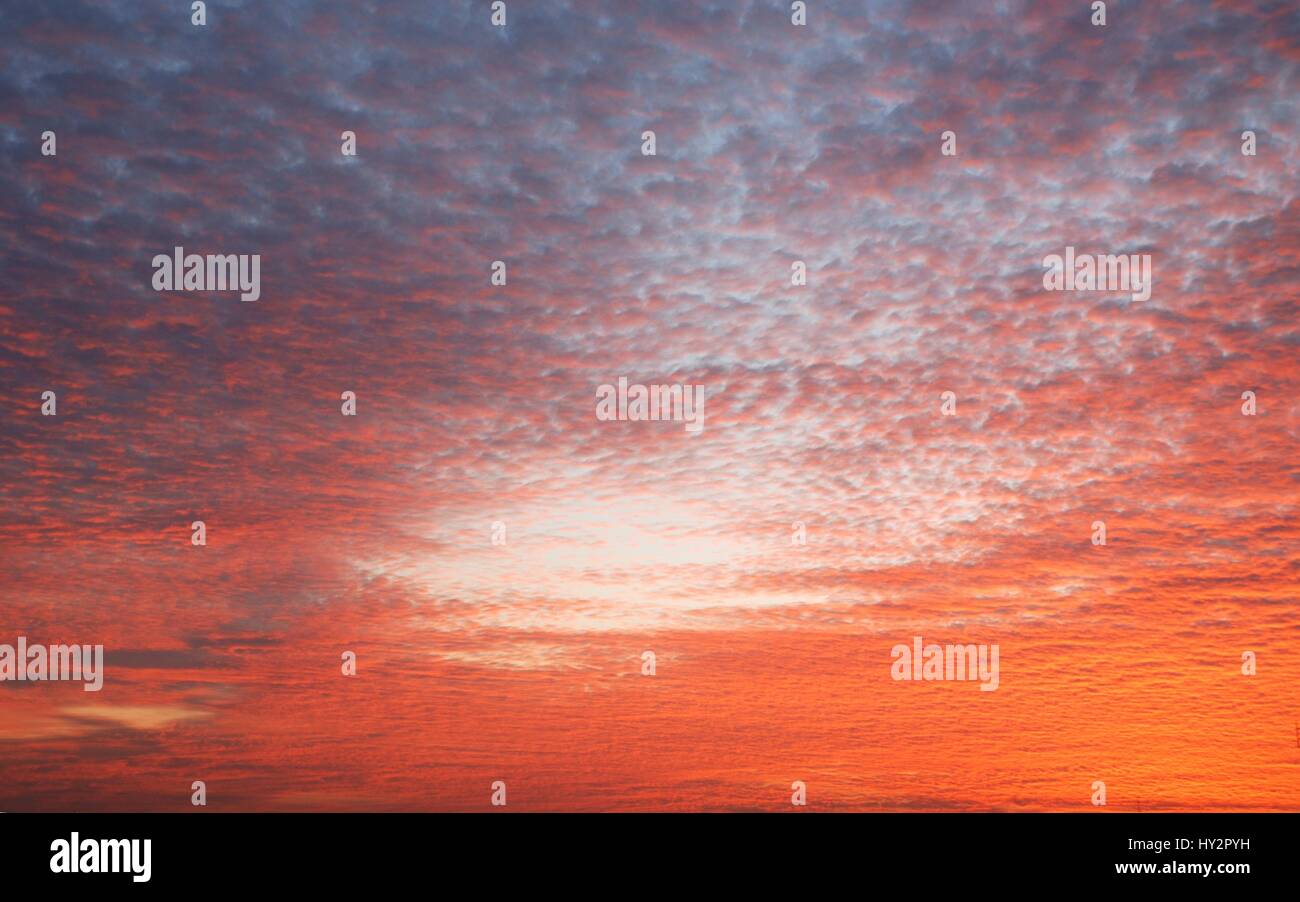Dramatic colorful orange color sky with clouds in the evening during ...