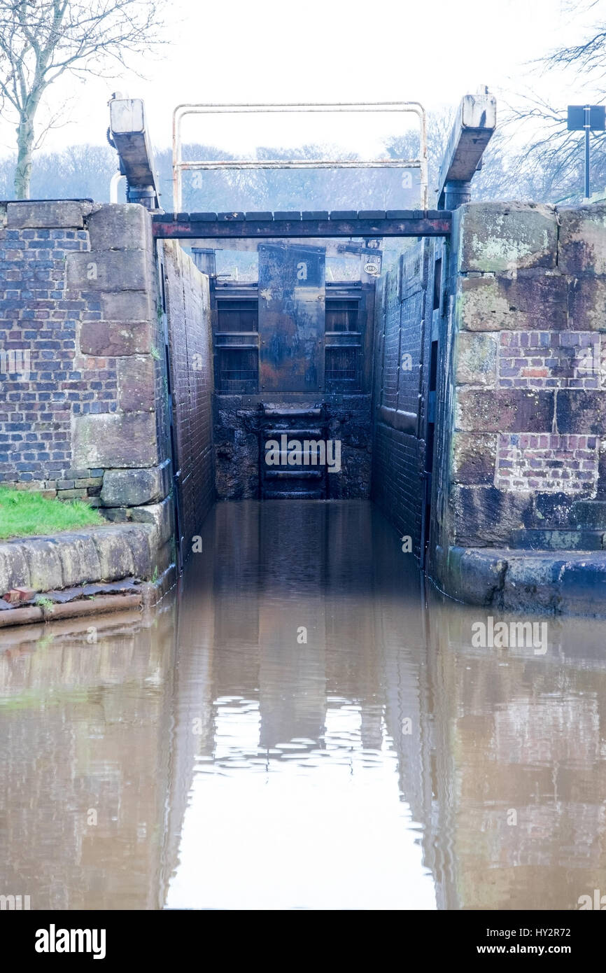 The open lock gates at Lock 48 on the Trent and Mersey canal at Church ...