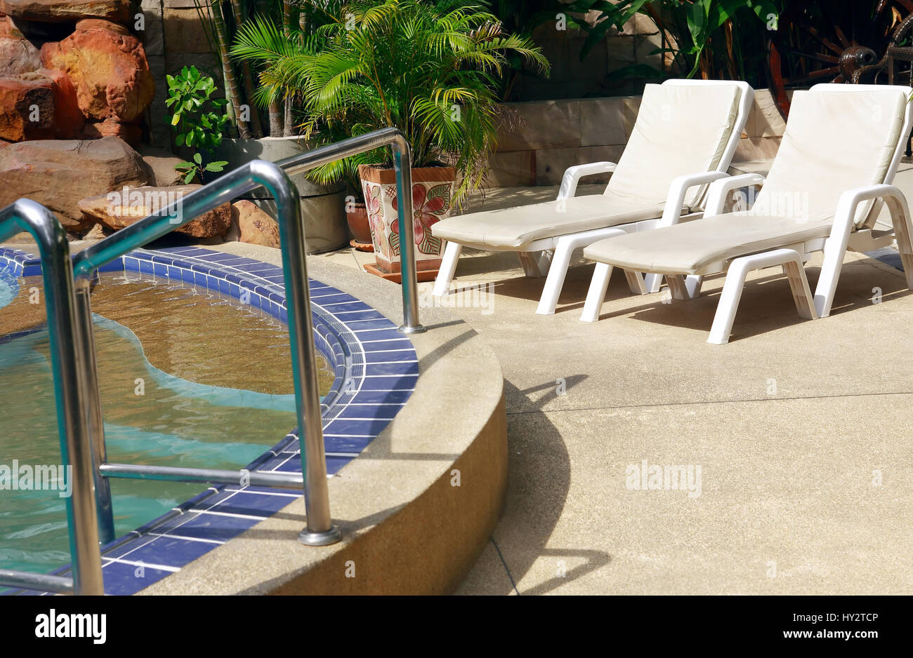 Closeup of elegant empty water pool with blue water near palm Stock ...