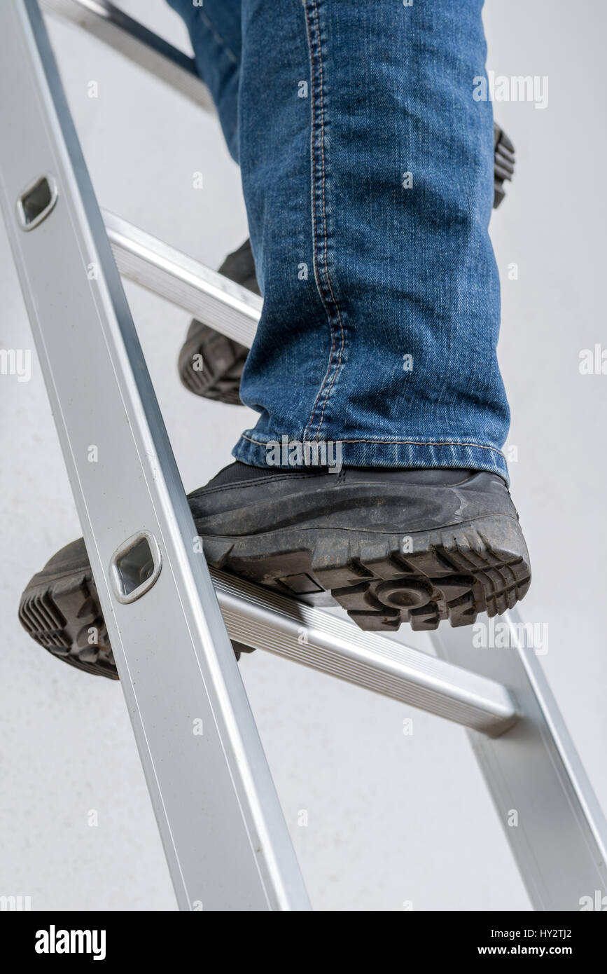 Person standing on a step ladder hi-res stock photography and images ...