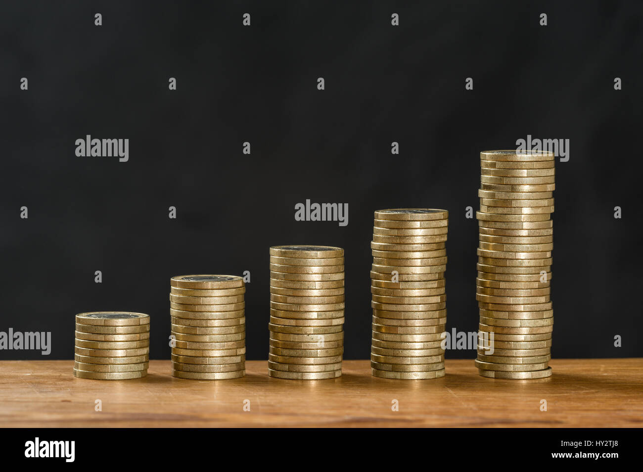 Coin stacks dark background hi-res stock photography and images - Alamy
