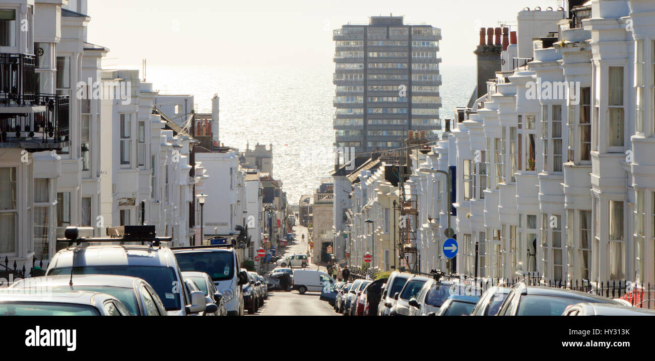 A view along a typical street in Brighton, leading down to the sea ...