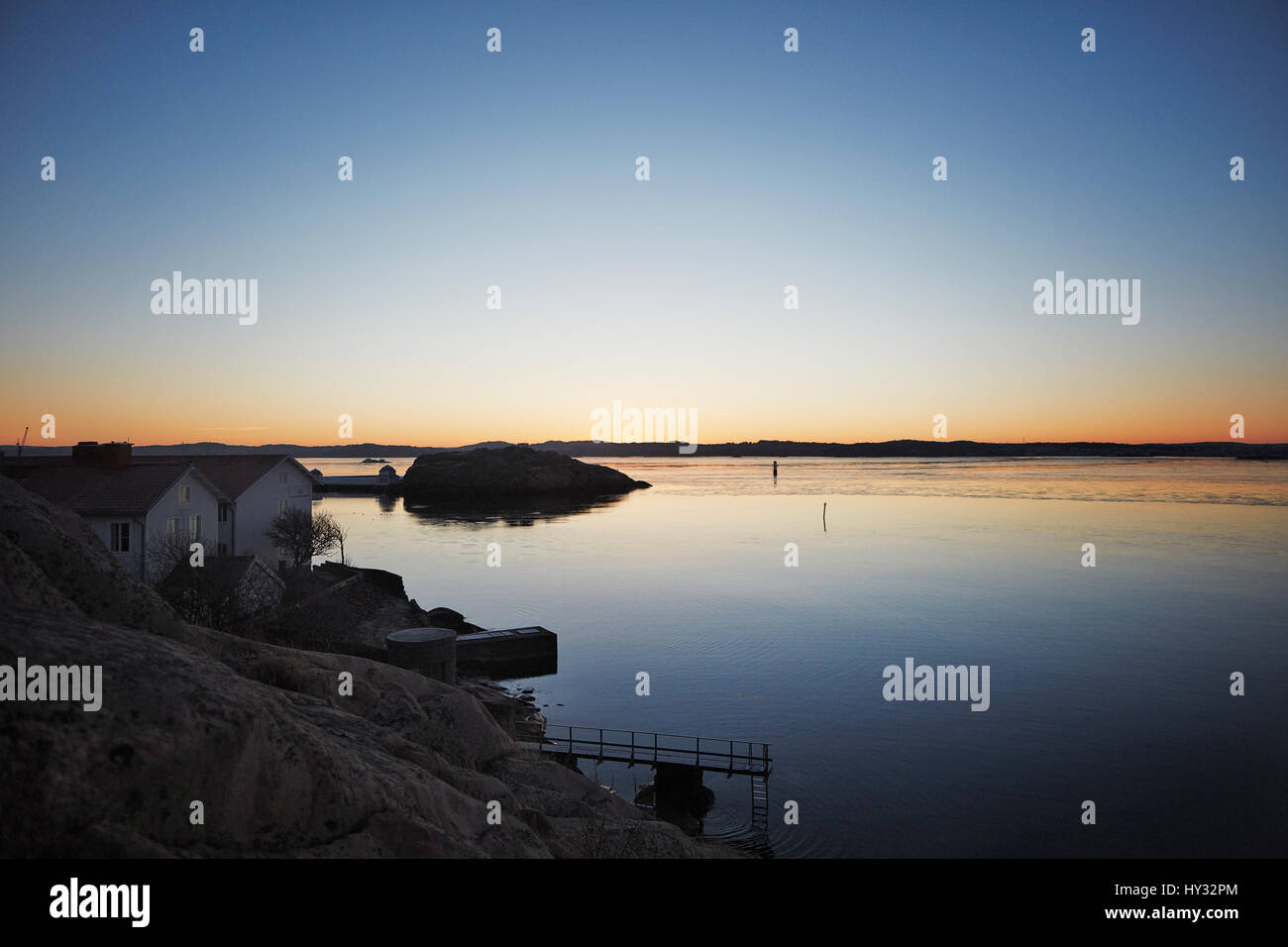 Sweden, West Coast, Lysekil, Scenic landscape with house and pier at ...