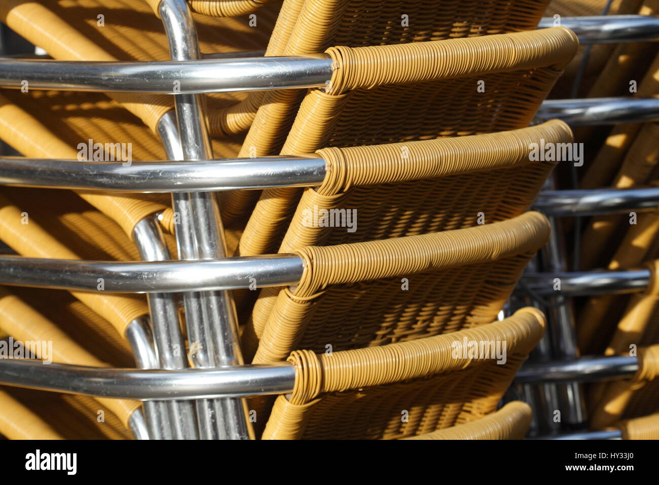staked metal chairs Stock Photo - Alamy