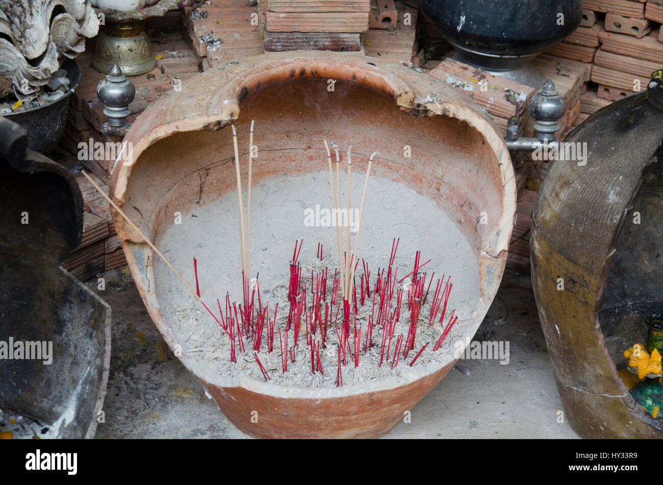 Burning incense at joss stick pot or thurible for respect and pray ...