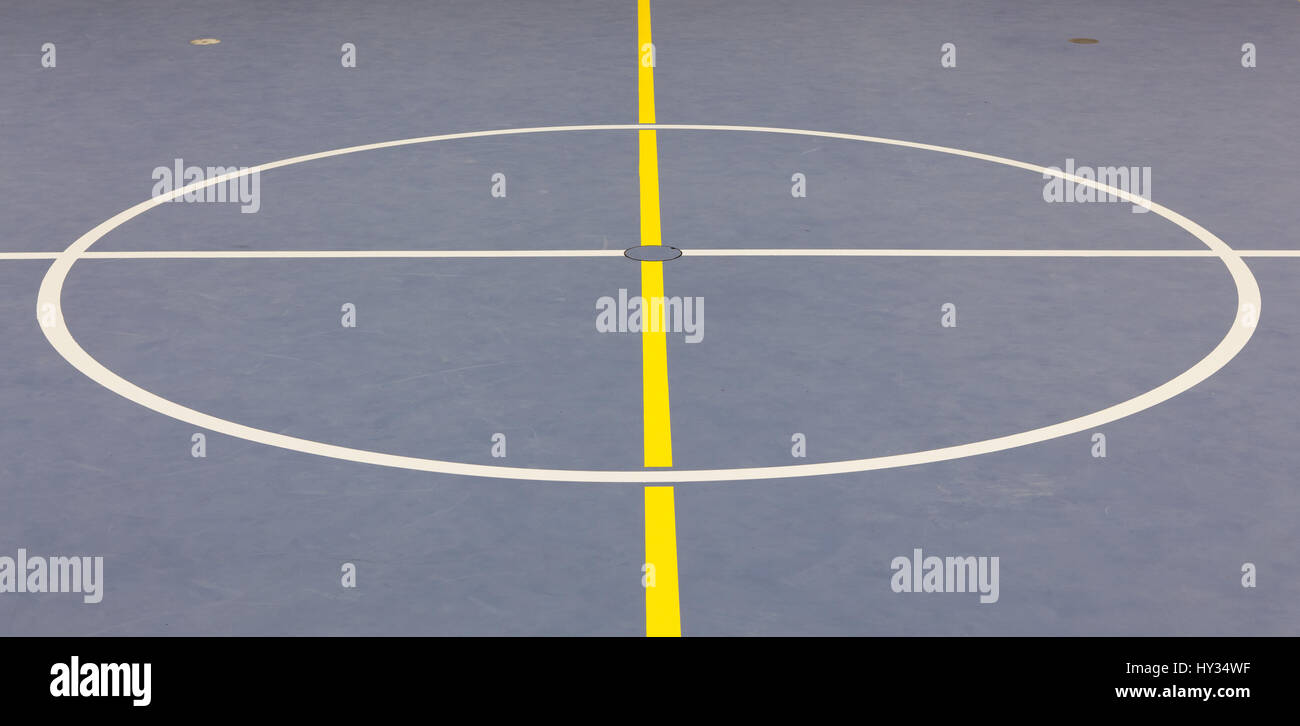 The middle circle on a blue indoor sports floor Stock Photo - Alamy