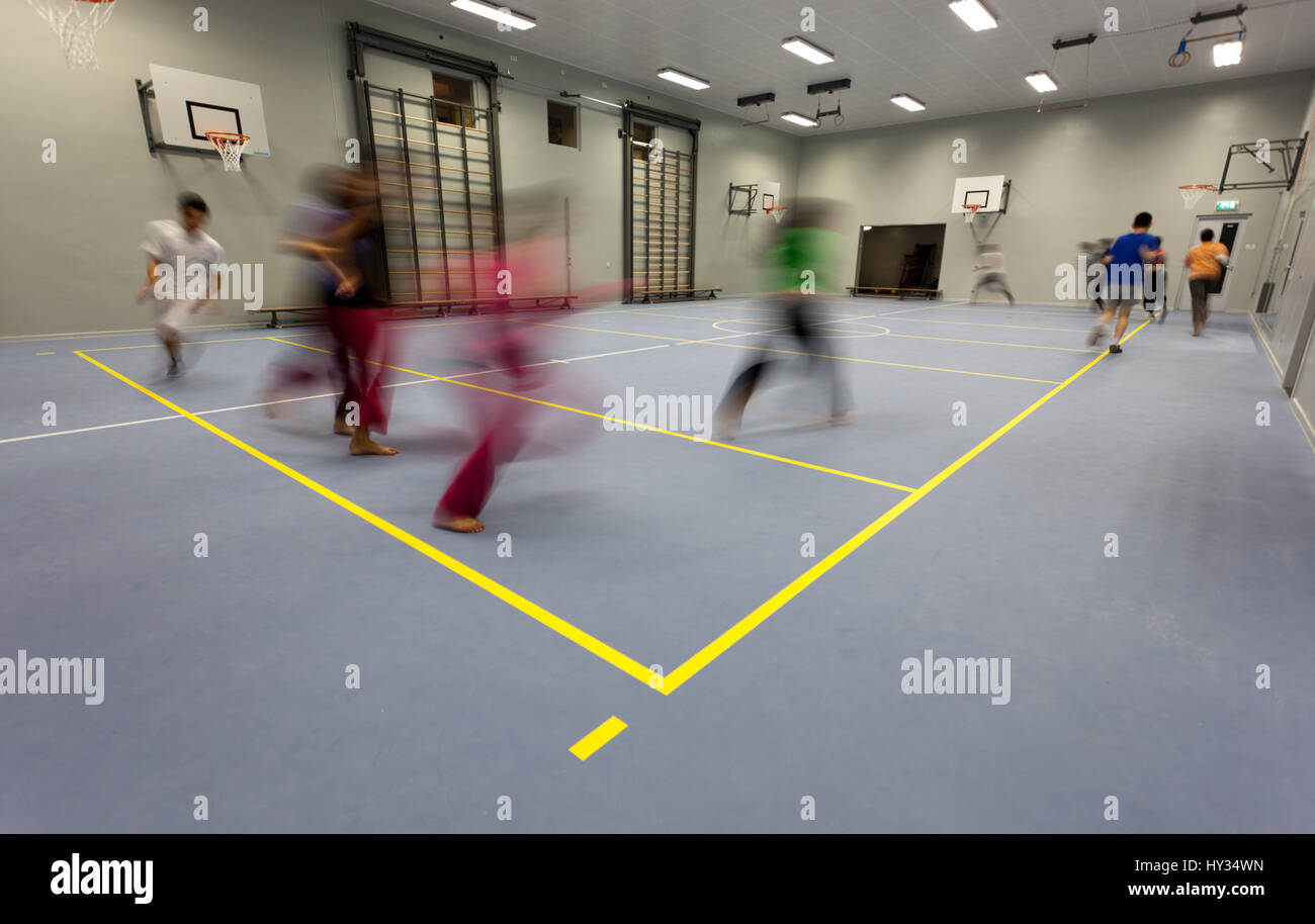Unrecognisable running children in an indoor sports hall Stock Photo ...