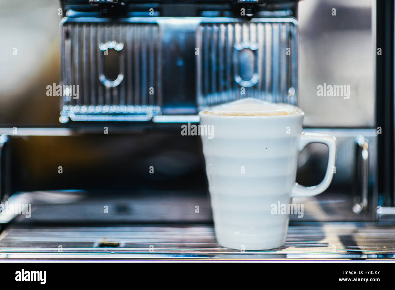 Mug of Coffee Under a Coffee Machine Stock Photo - Alamy
