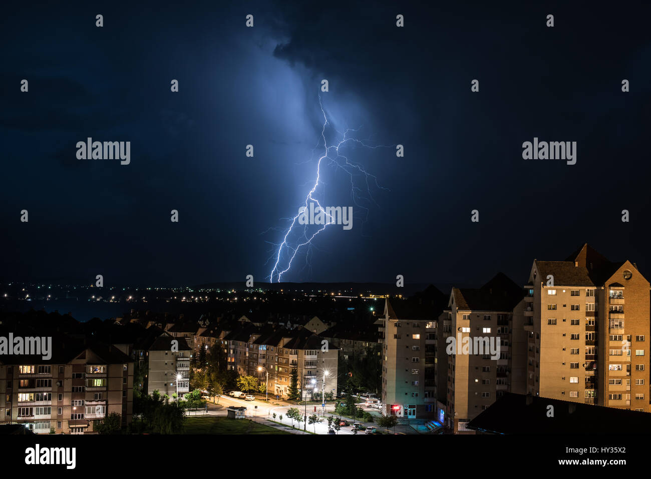 Lightning storm over the city. Thunderstorm and lightning over the city ...