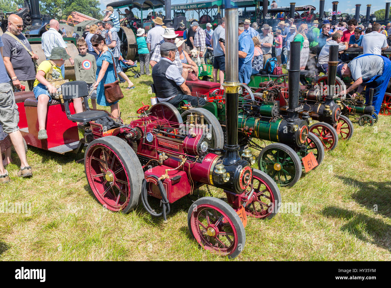 A collection of miniature traction engines on display in the show ring ...